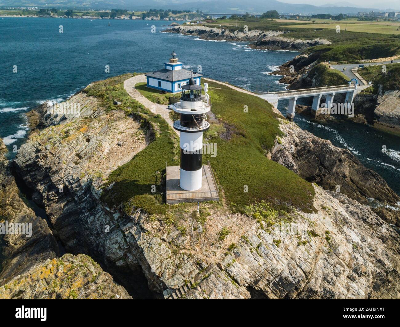 Aerial view of the lighthouse on Pancha island. Northern Spain in ...