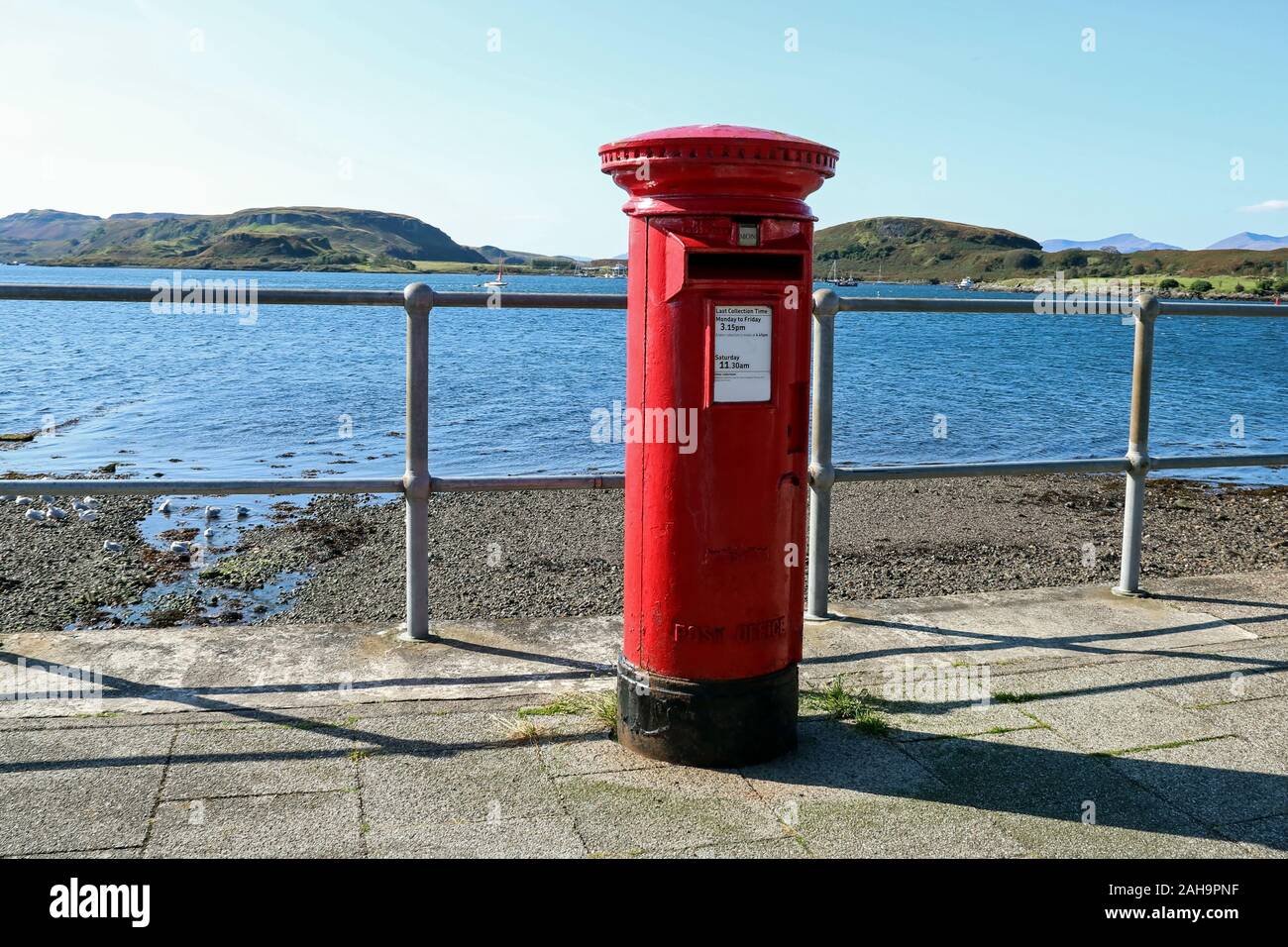 Old red royal mail post box at a seafront location in Scotland Stock ...