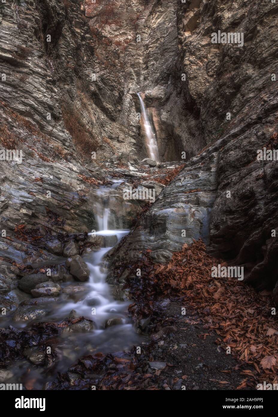 Waterfall in a mountain gorge Stock Photo - Alamy