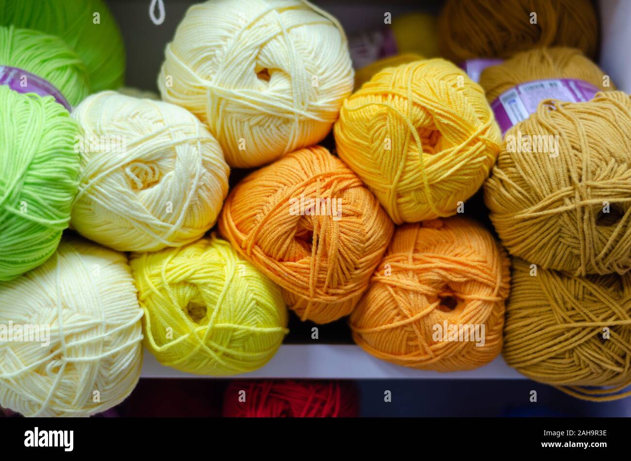 Colorful wool balls on shelf compartment in haberdashery Stock Photo ...