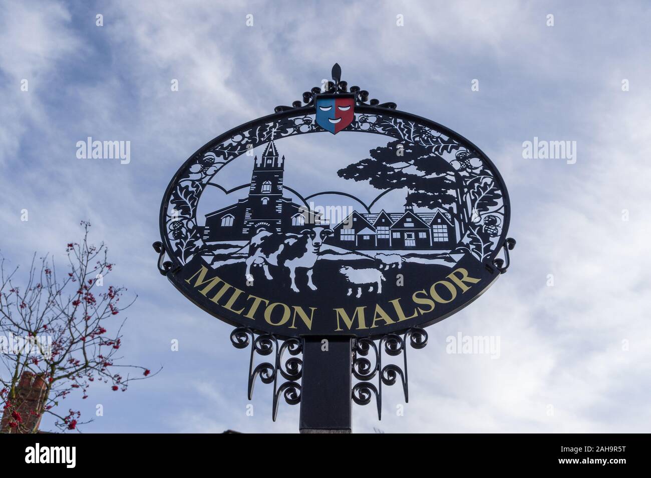 Oval black metal cut out style sign for the village of Milton Malsor ...