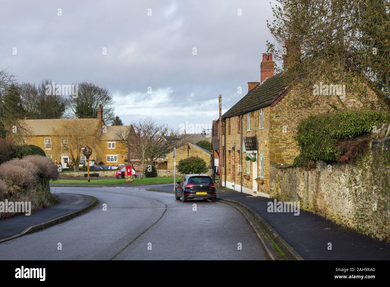 Winter street scene in the village of Milton Malsor, Northamptonshire ...
