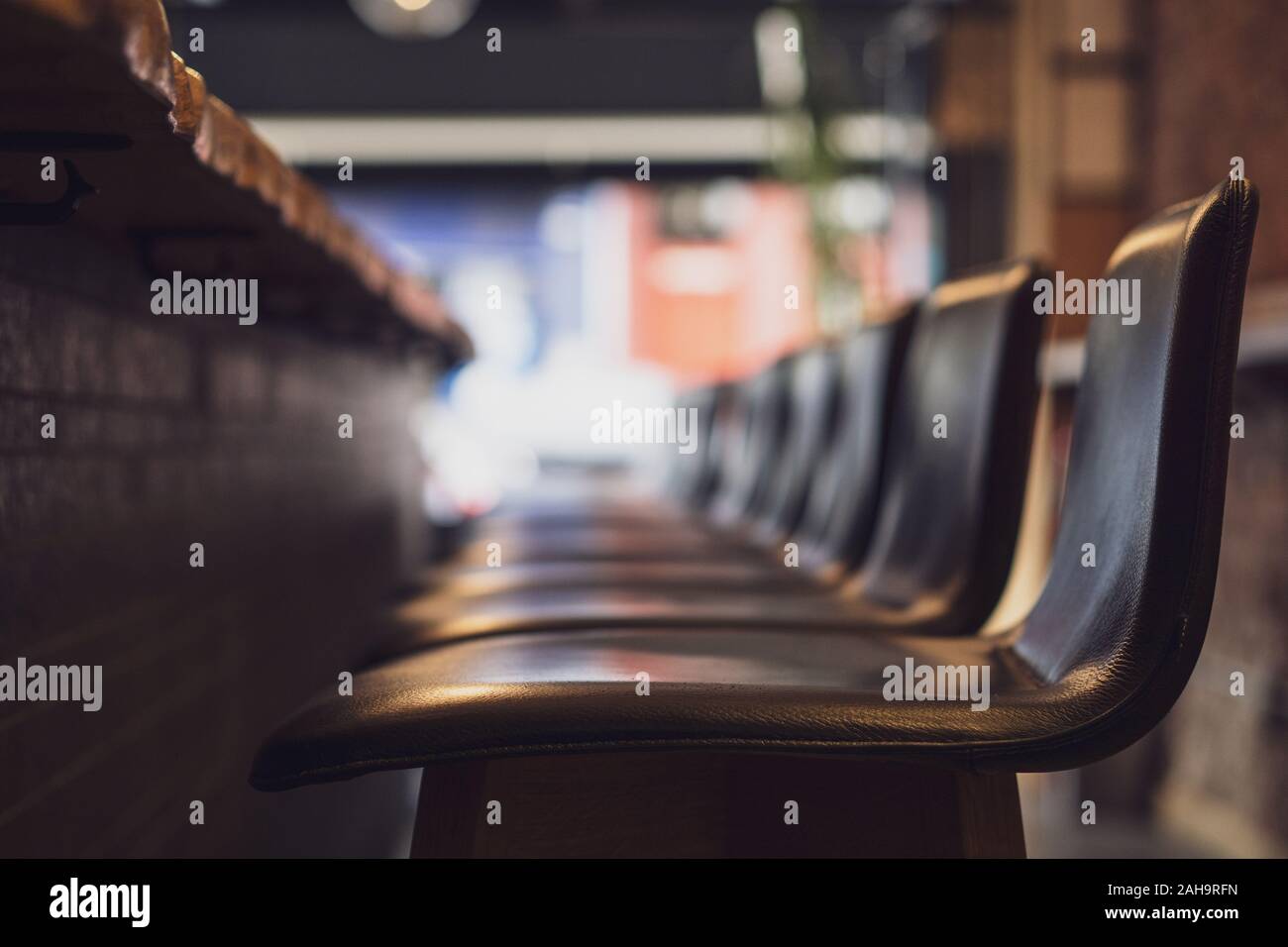 High stools aligned in front of the counter of a restaurant Stock Photo ...