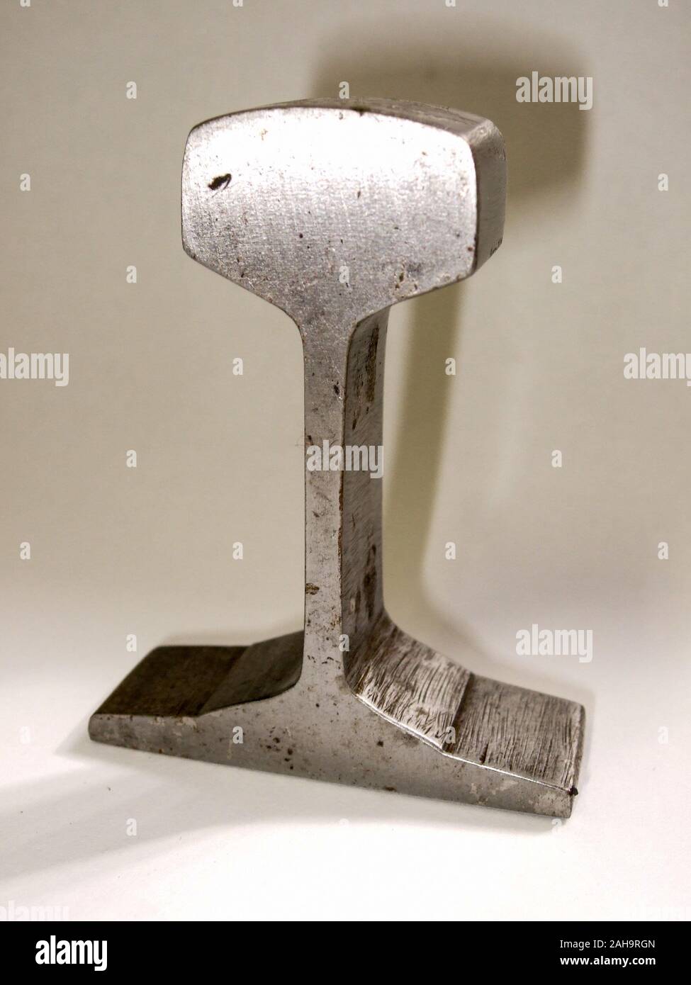 A section of a small size rail shows the profile after rolling Stock ...