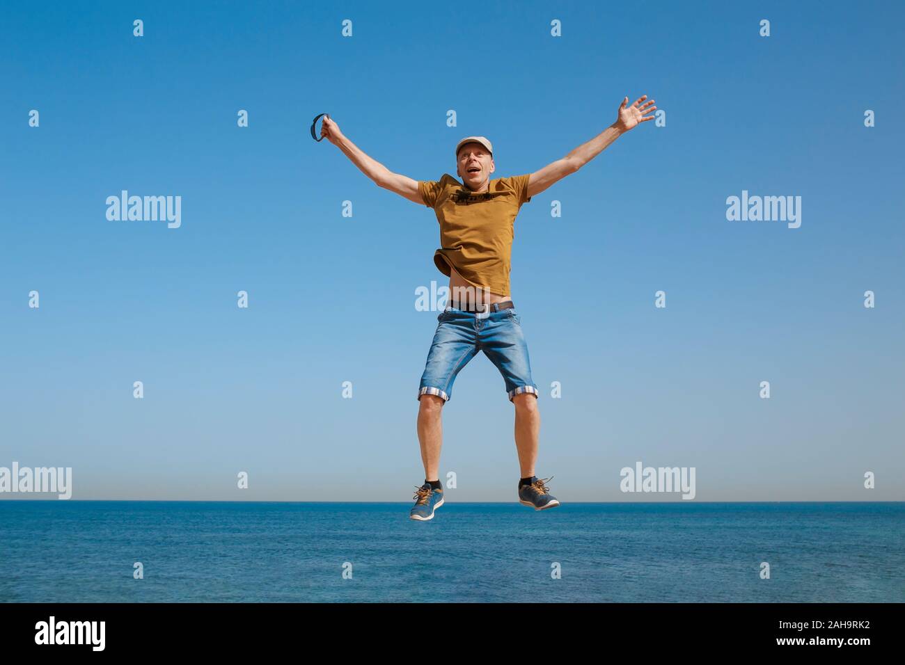 Positive jump over the sea horizon Stock Photo - Alamy