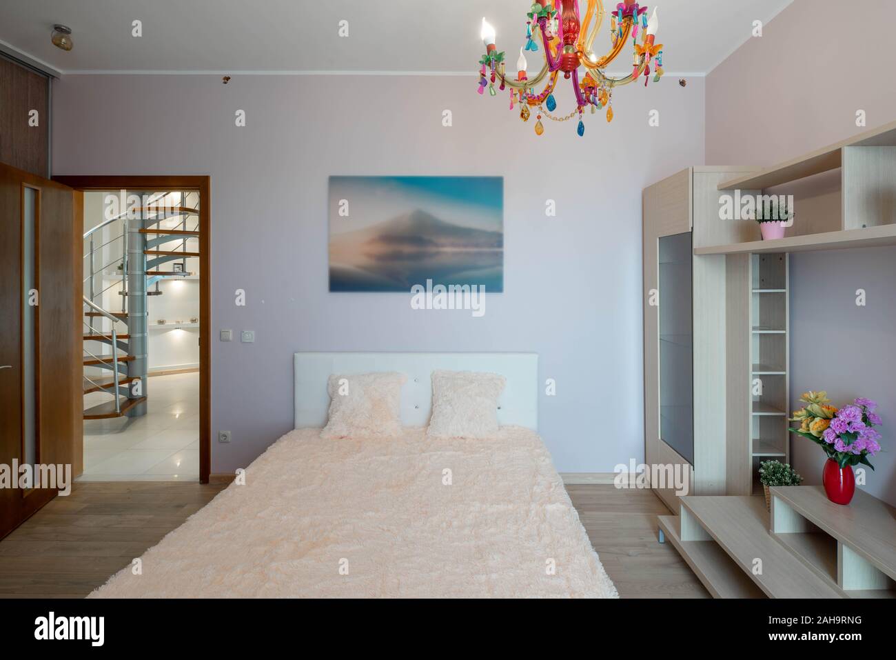 Front view of king-size bed. Modern interior of bedroom in light tones ...