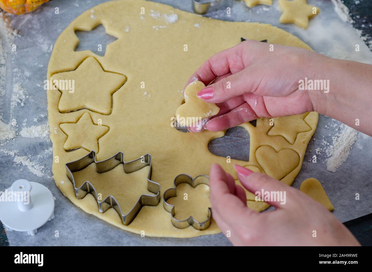 Woman is making Christmas gingerbread cookies in the kitchen Stock ...