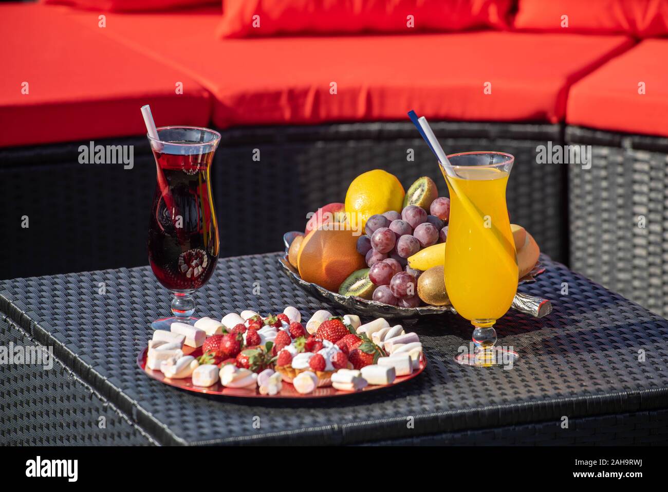 Romantic composition. Couple of drinks. Fruits and delicious desserts ...