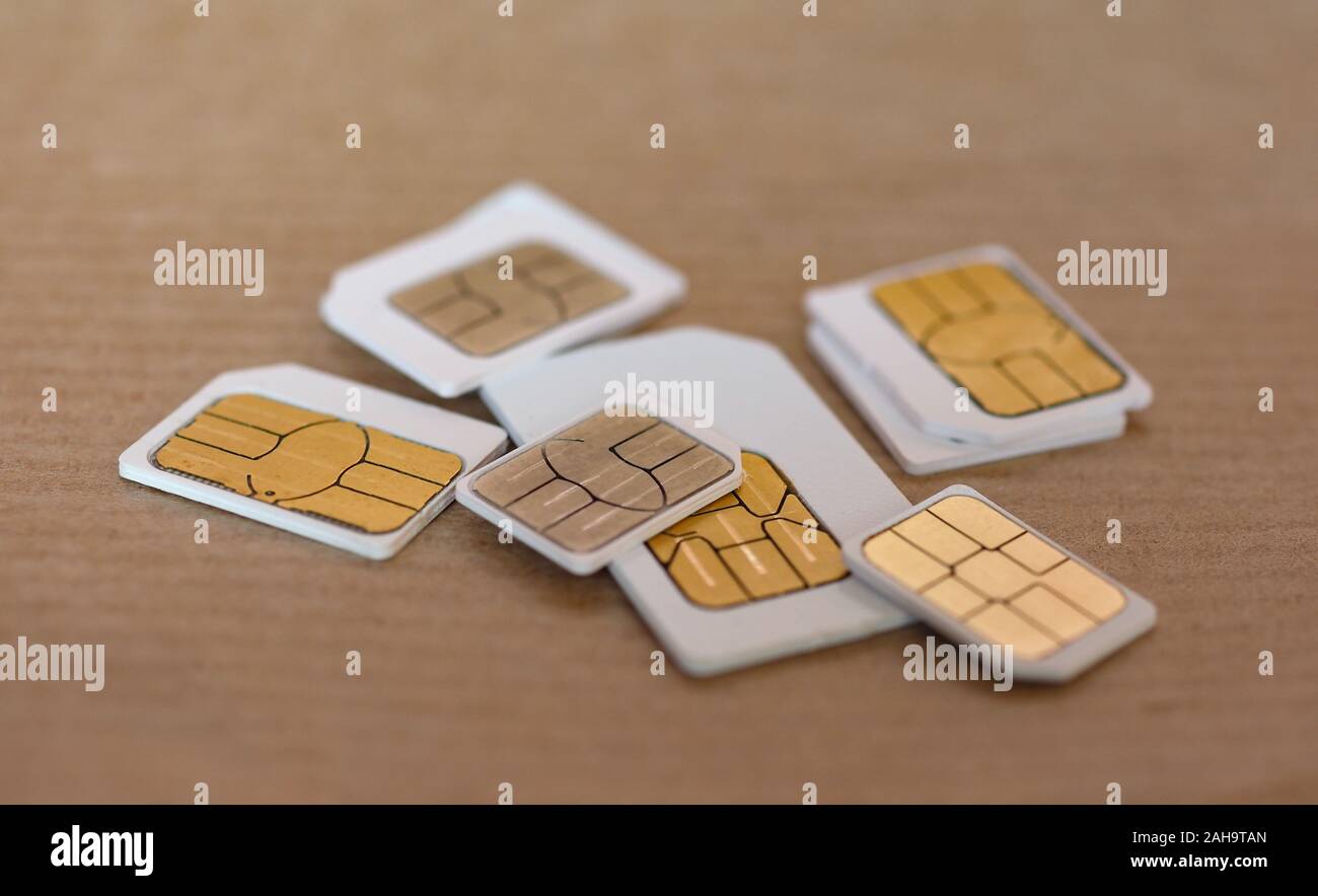 Many mini micro and nano sim cards for mobile telephone Stock Photo - Alamy
