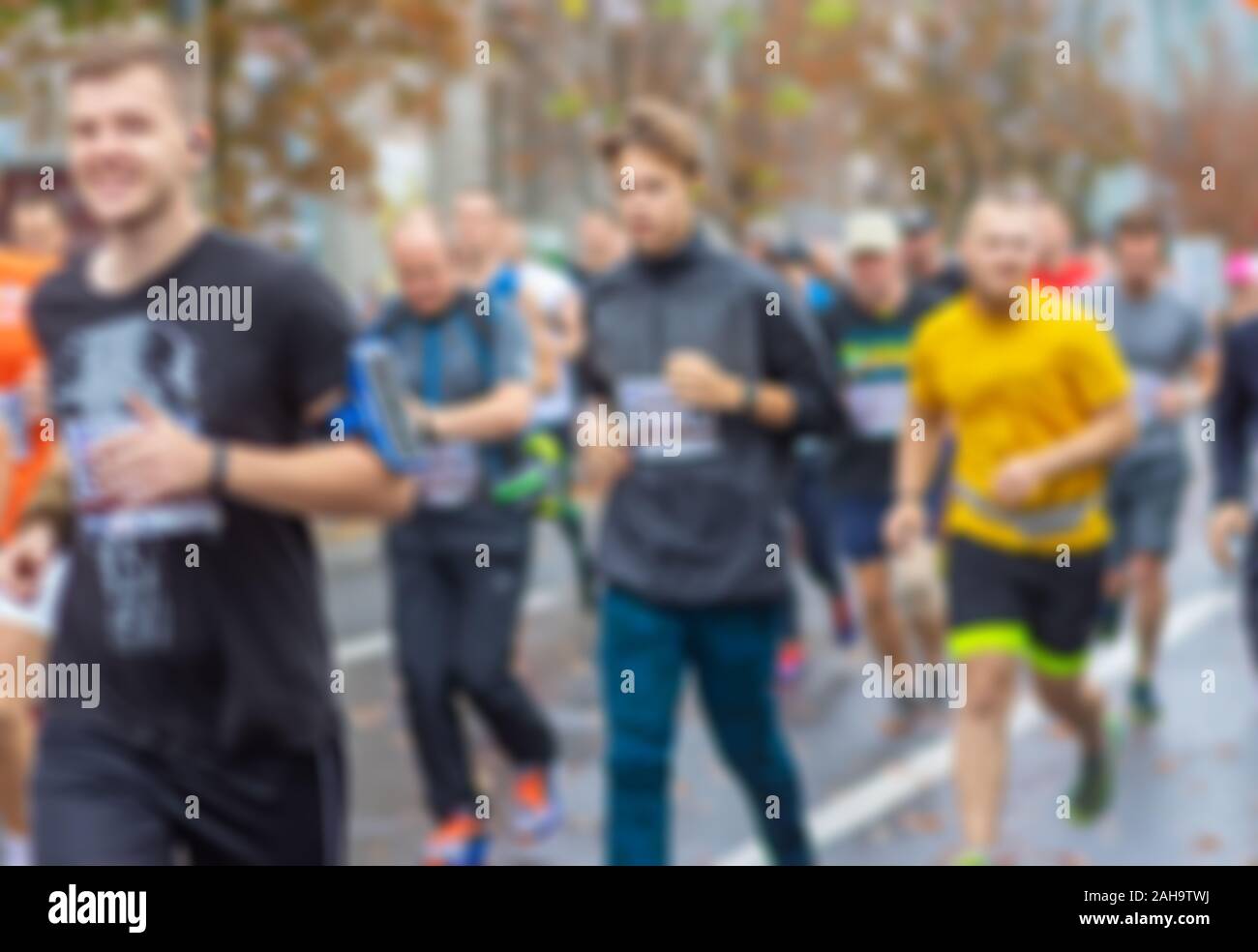Blurry sport background - mass of people running on a street at fall ...