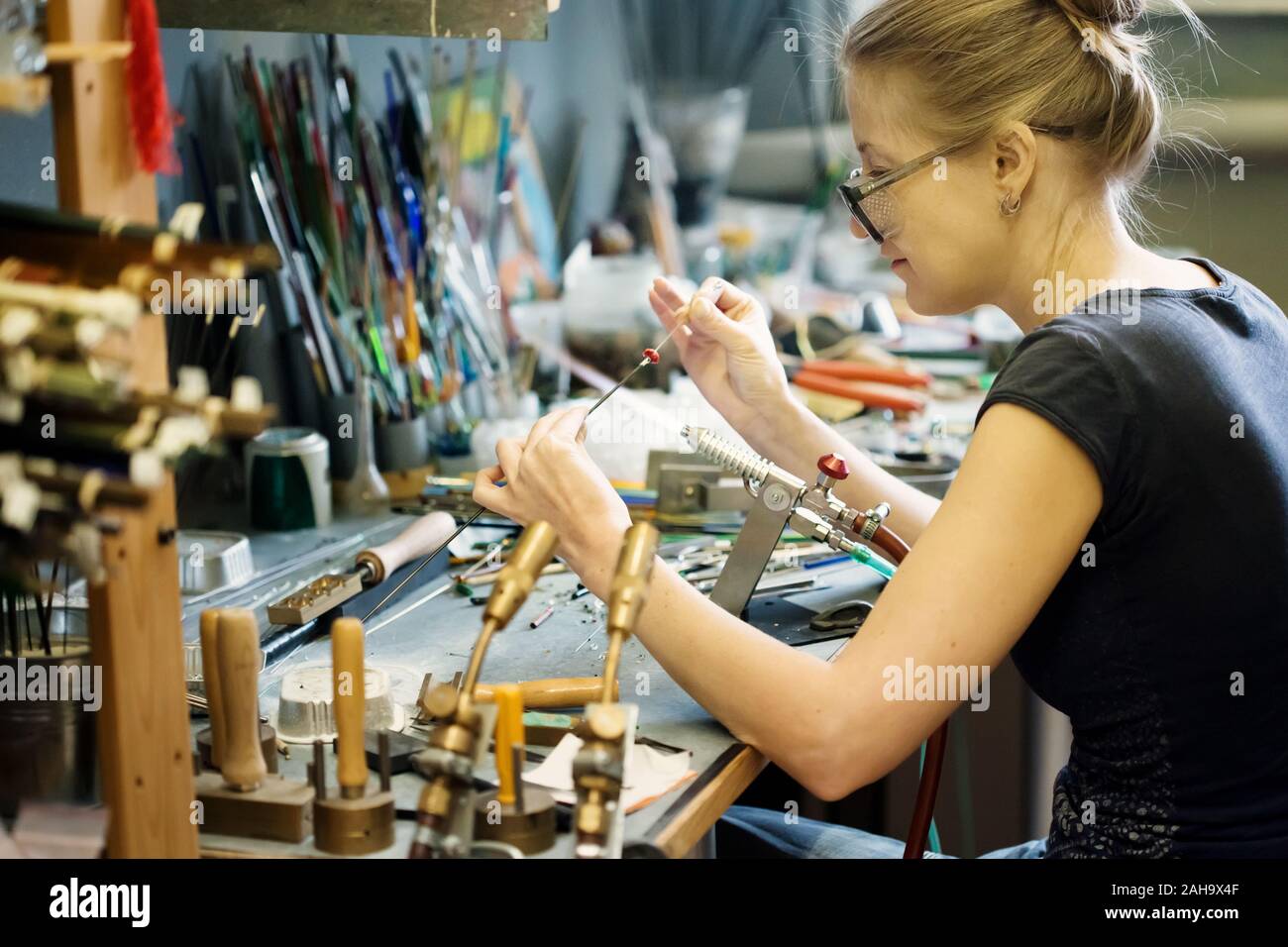 Woman making jewelry in workshop hi-res stock photography and images ...