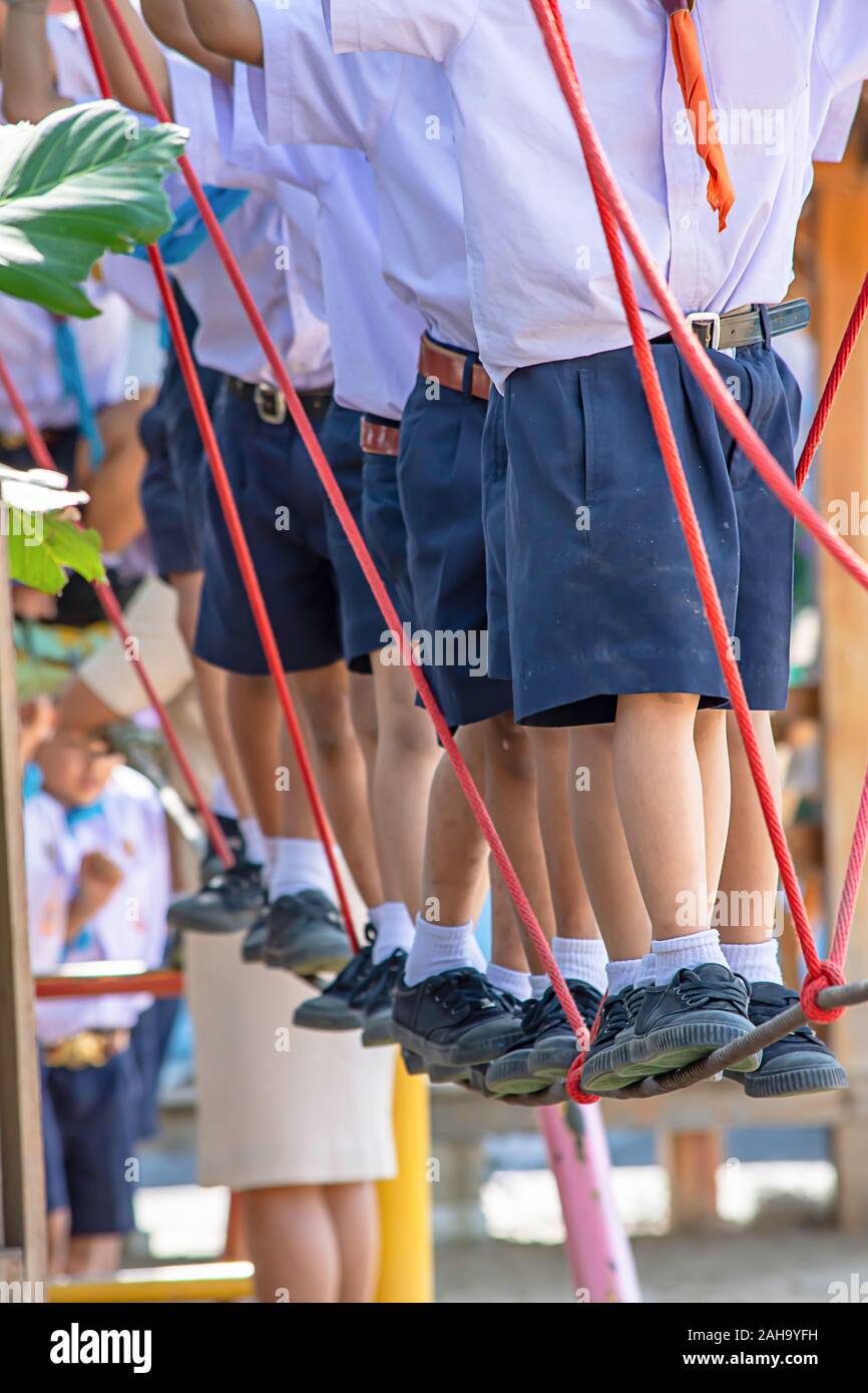 Children walking on the wire rope are doing the activity Stock Photo ...