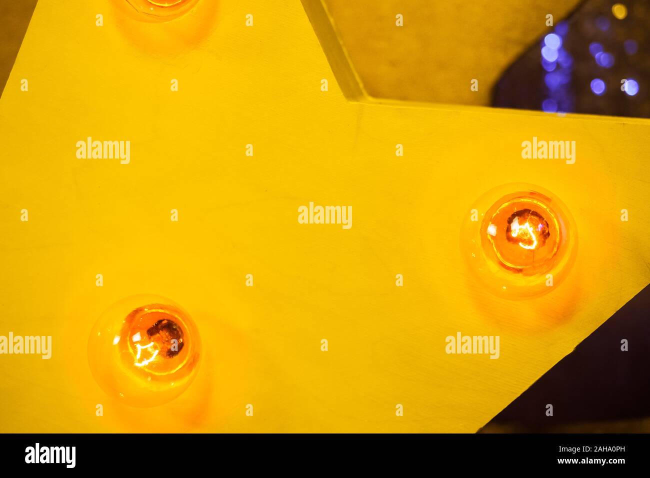 Wooden yellow star with bulb lights lit on it christmas background ...