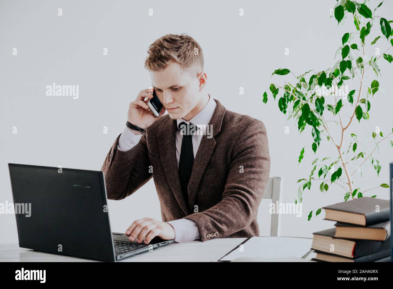 a man works in the Office at the computer business clerk Stock Photo ...