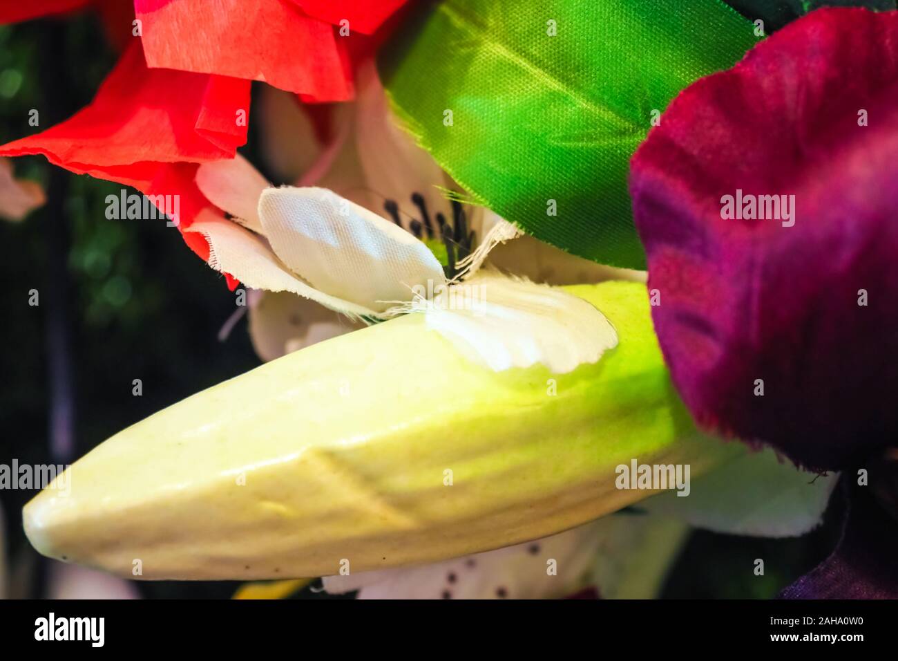 Colorful silk artificial flowers background Stock Photo - Alamy