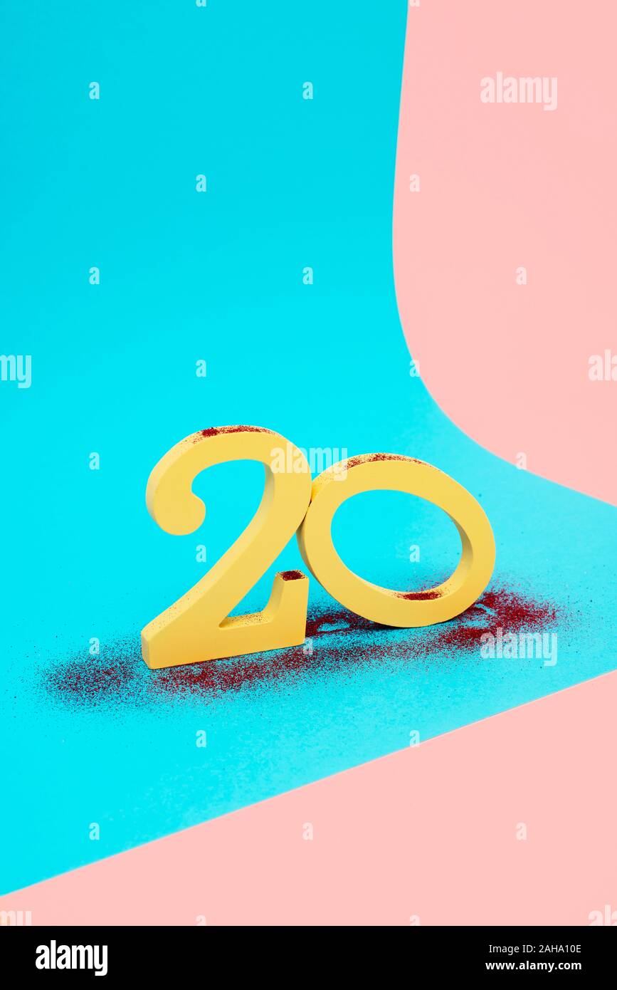 closeup of two yellow three-dimensional numbers forming the number 20 ...