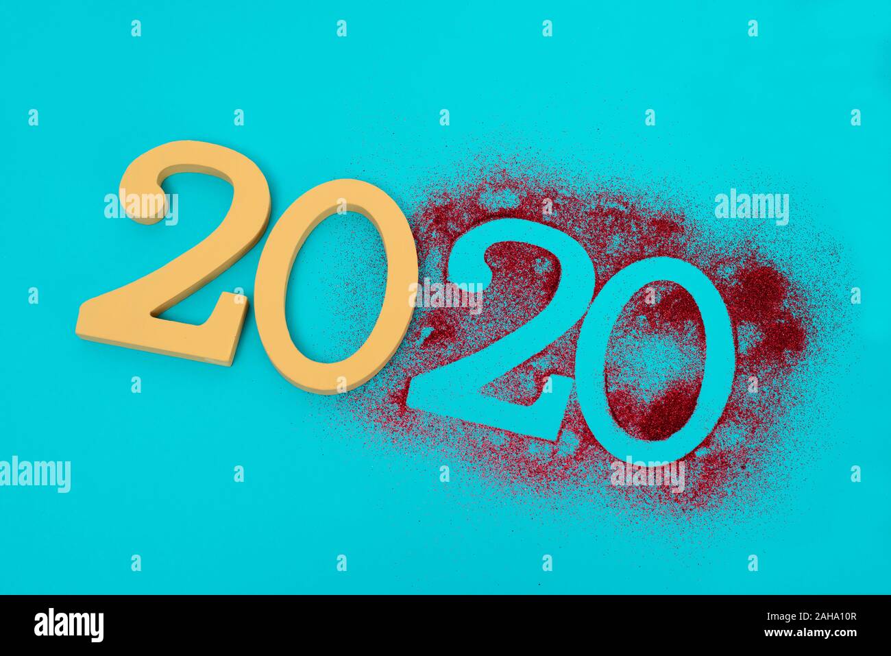 two yellow three-dimensional numbers forming the number 20 and the ...