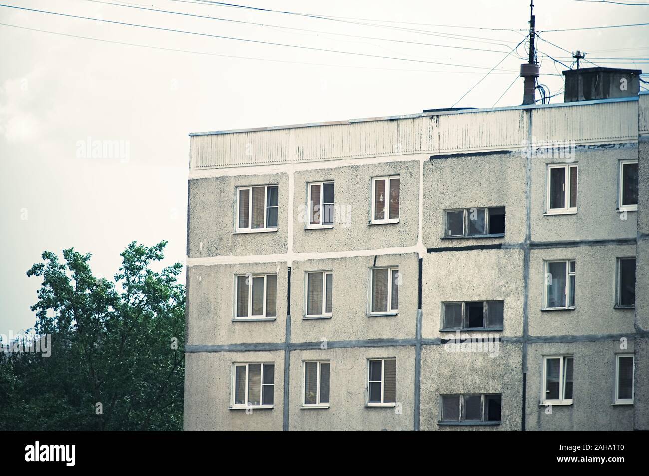 Gray facade of old multi-storey residential building from USSR times in ...