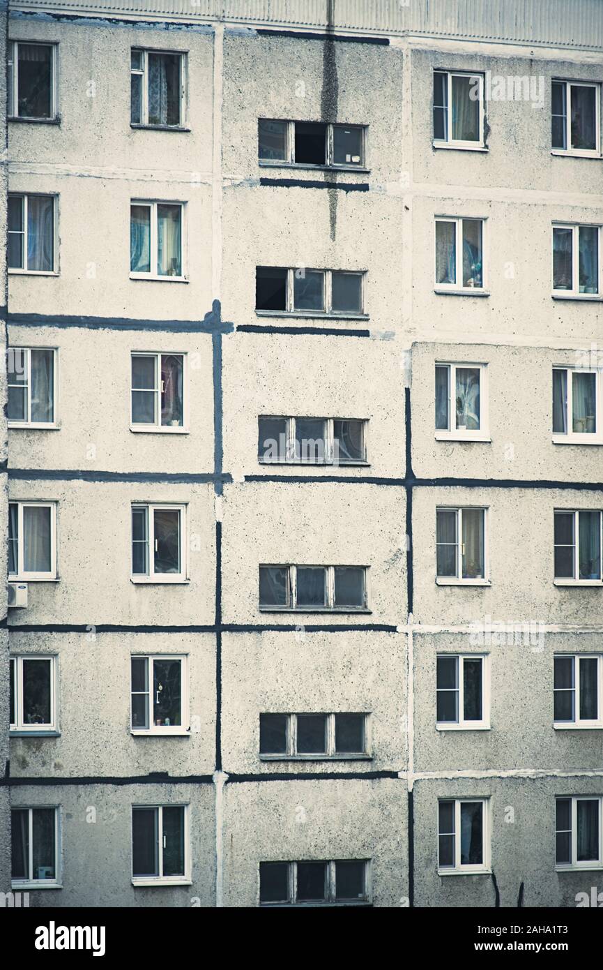 Gray facade of old multi-storey residential building from USSR times in ...