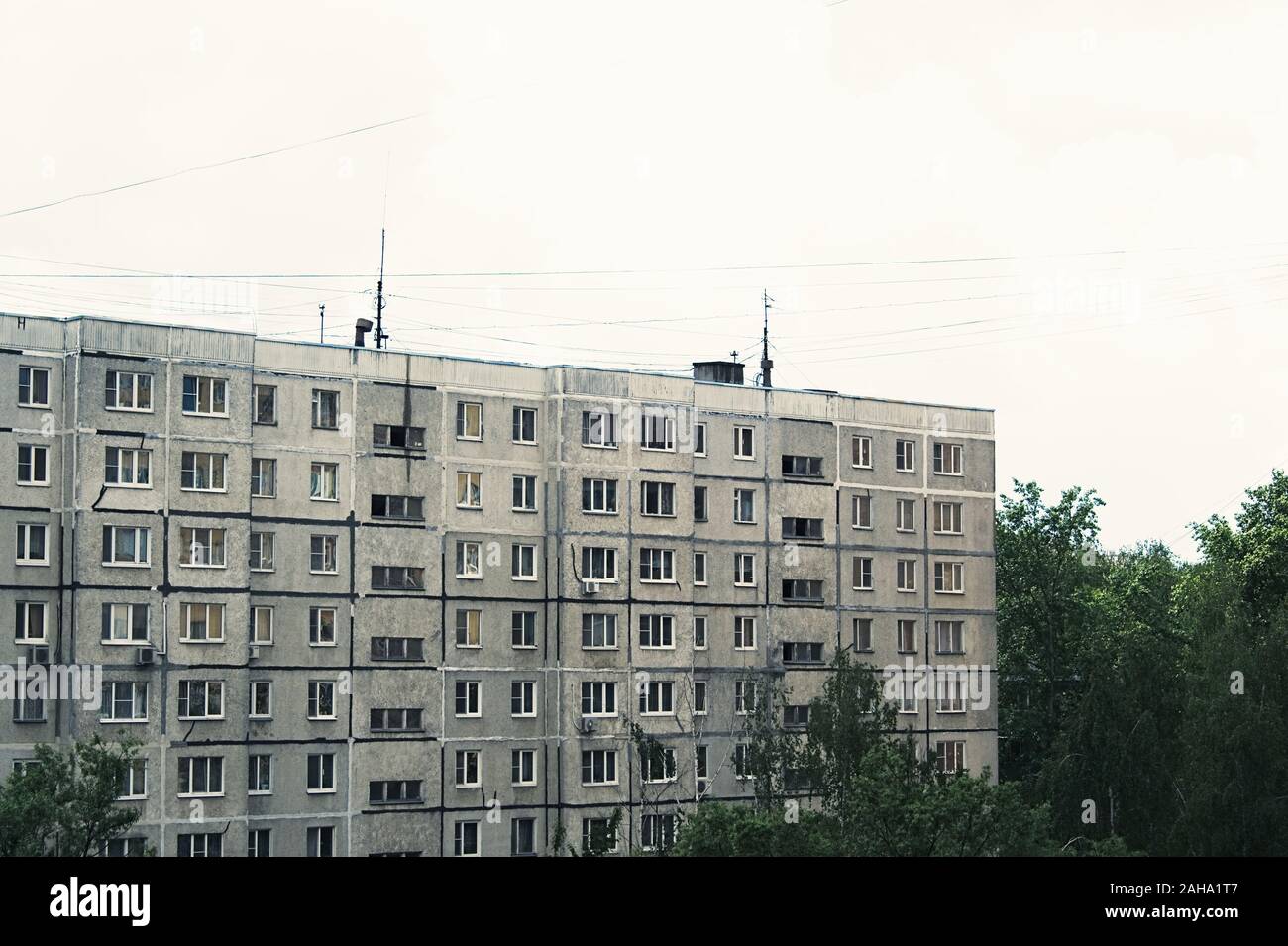 Gray facade of old multi-storey residential building from USSR times in ...