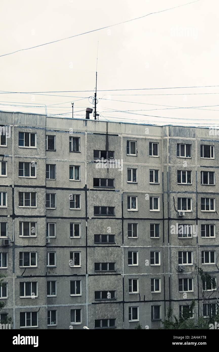 Gray facade of old multi-storey residential building from USSR times in ...