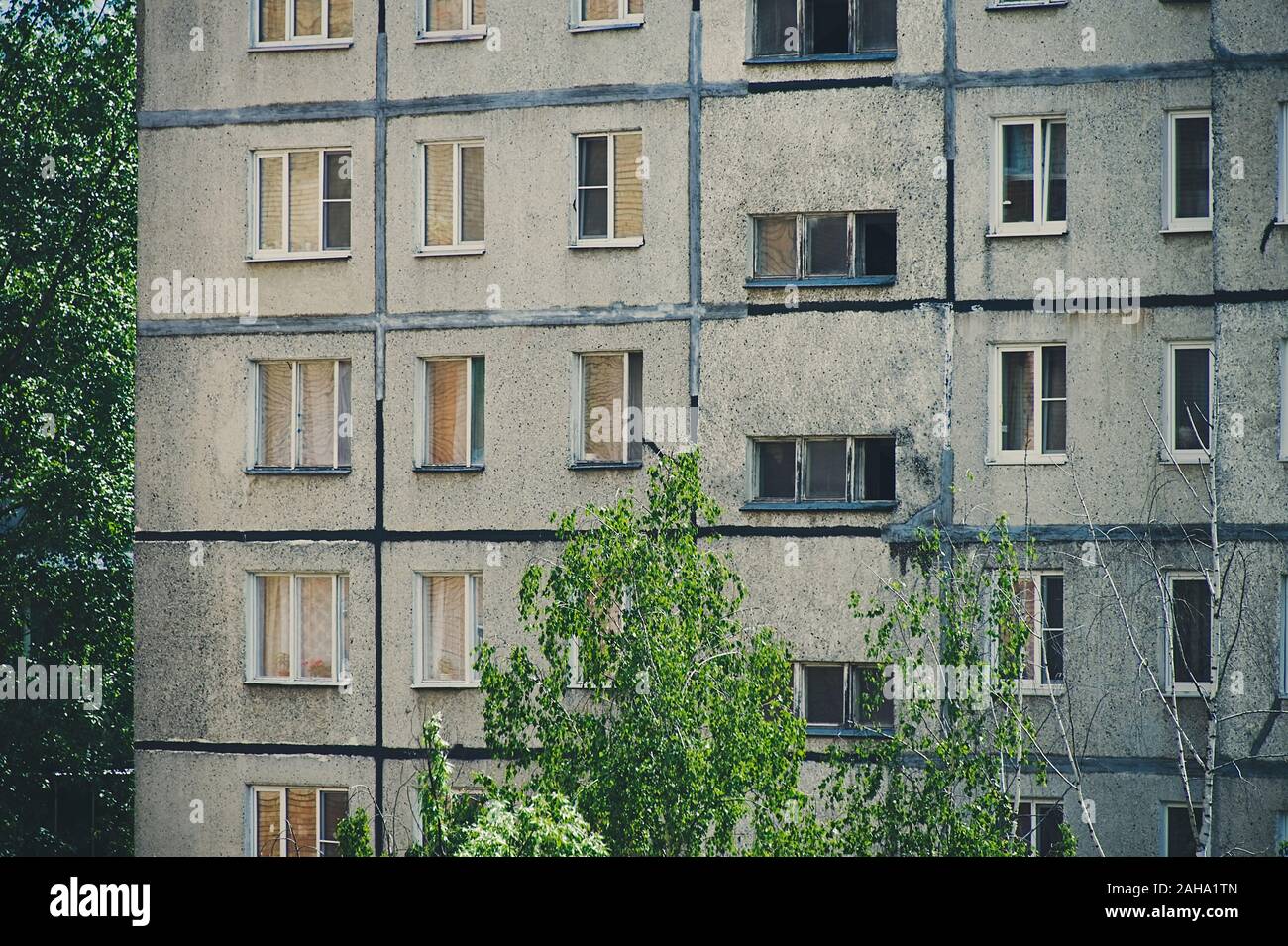 Gray facade of old multi-storey residential building from USSR times in ...