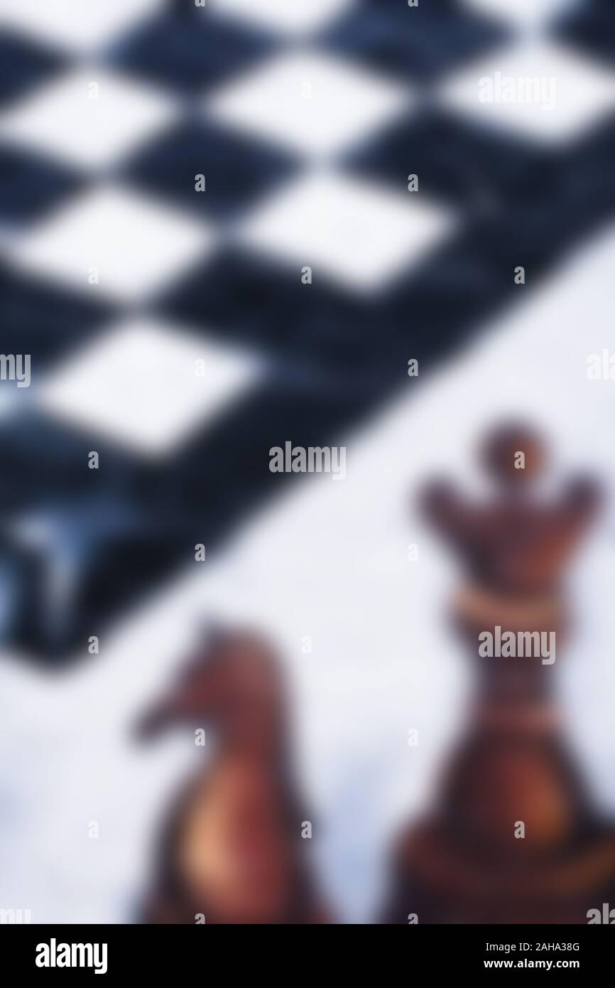 Artistic graffiti chess blurred elements on a grunge white brick wall ...