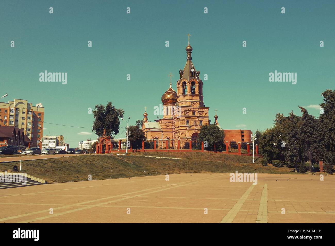 Orthodox red church architecture in green park in Russia background ...