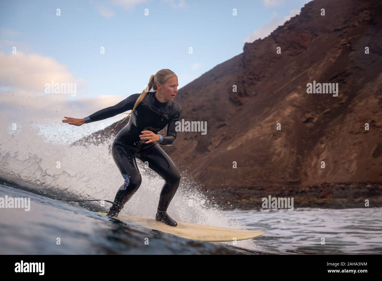 Surfer riding waves on the island of fuerteventura Stock Photo - Alamy