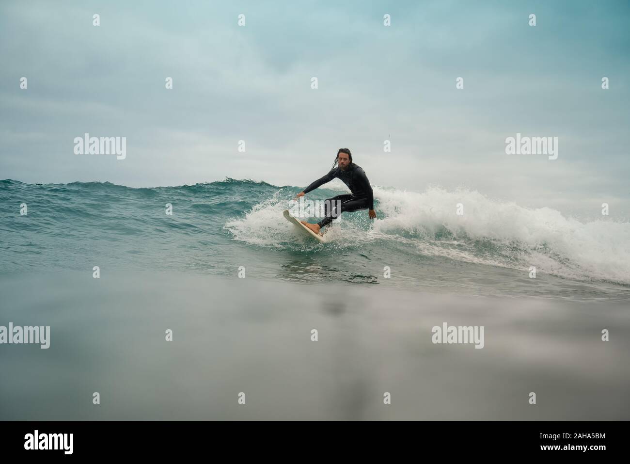 Surfer riding waves on the island of fuerteventura Stock Photo - Alamy