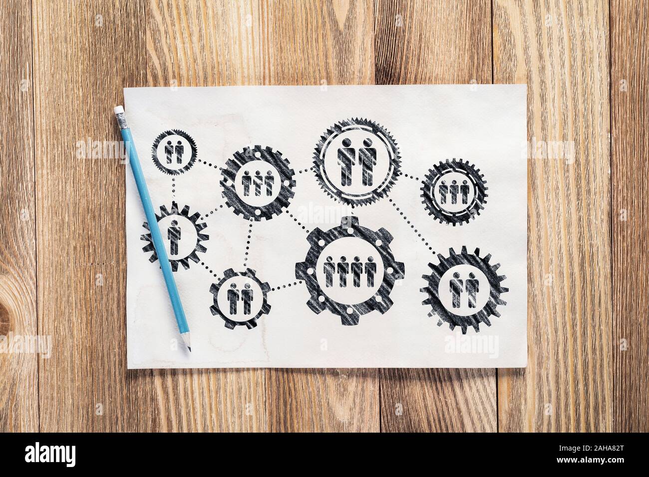 Social structure hand drawn with group of rotating gears and cogs ...
