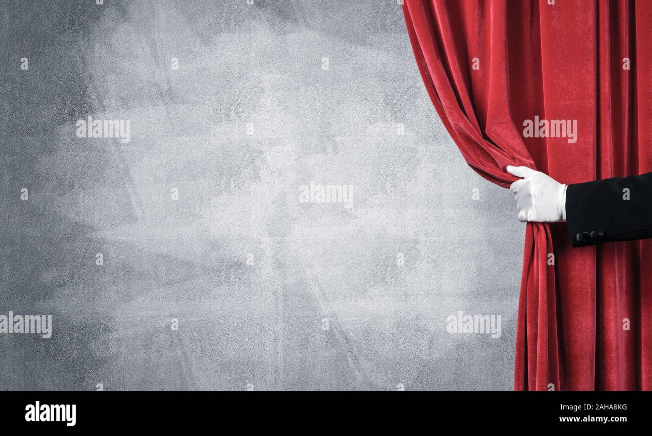 Close up of hand in white glove open red velvet curtain Stock Photo - Alamy