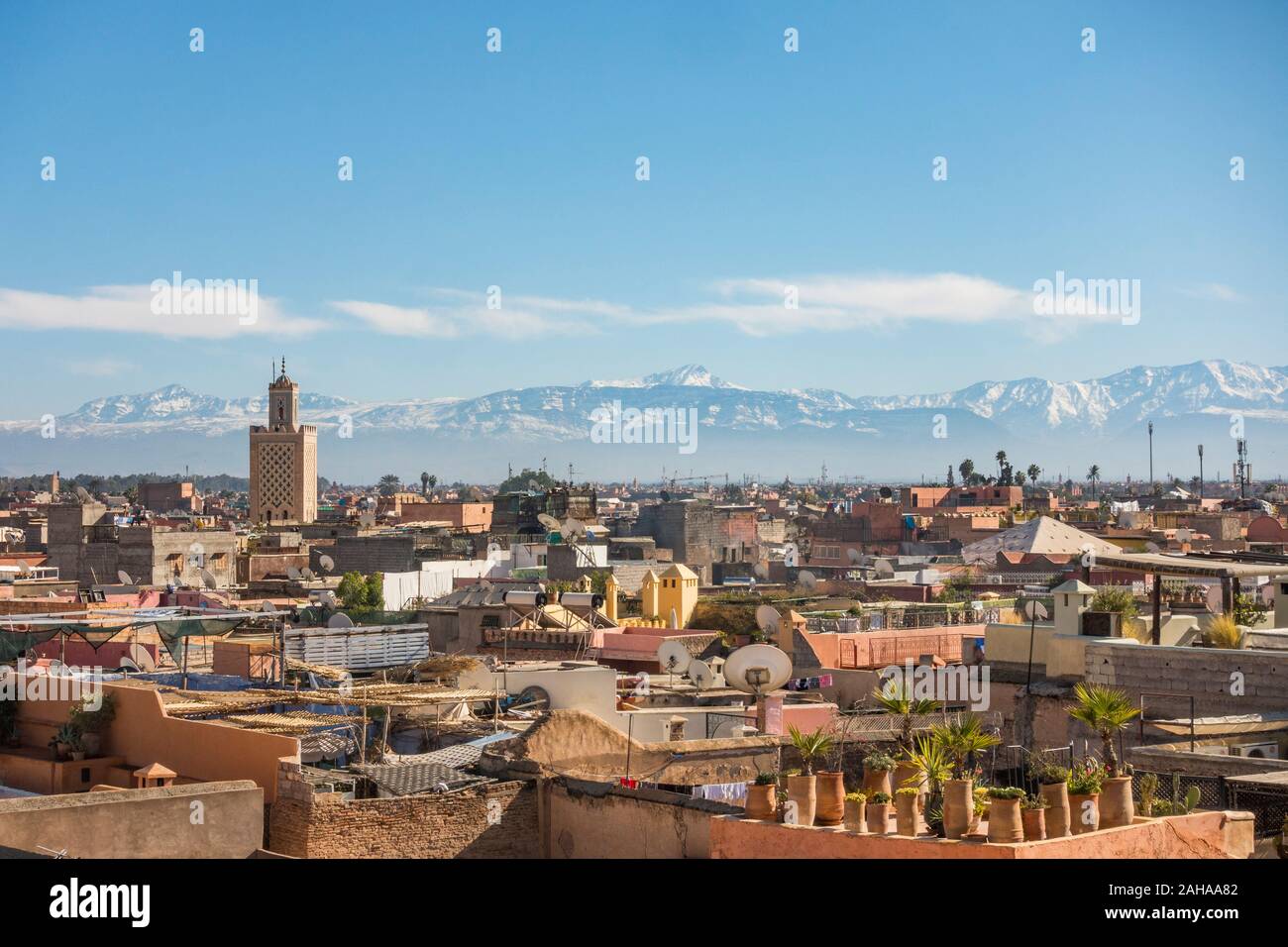 Marrakech city skyline in Medina area, with Atlas mountains behind ...