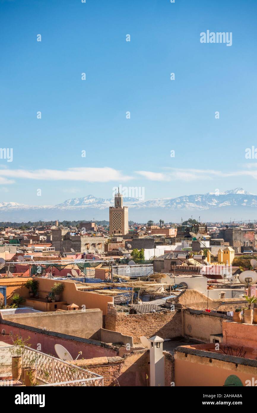 Marrakech city skyline in Medina area, with Atlas mountains behind ...