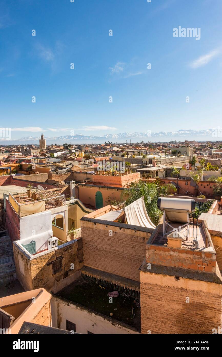 Marrakech city skyline in Medina area, with Atlas mountains behind ...