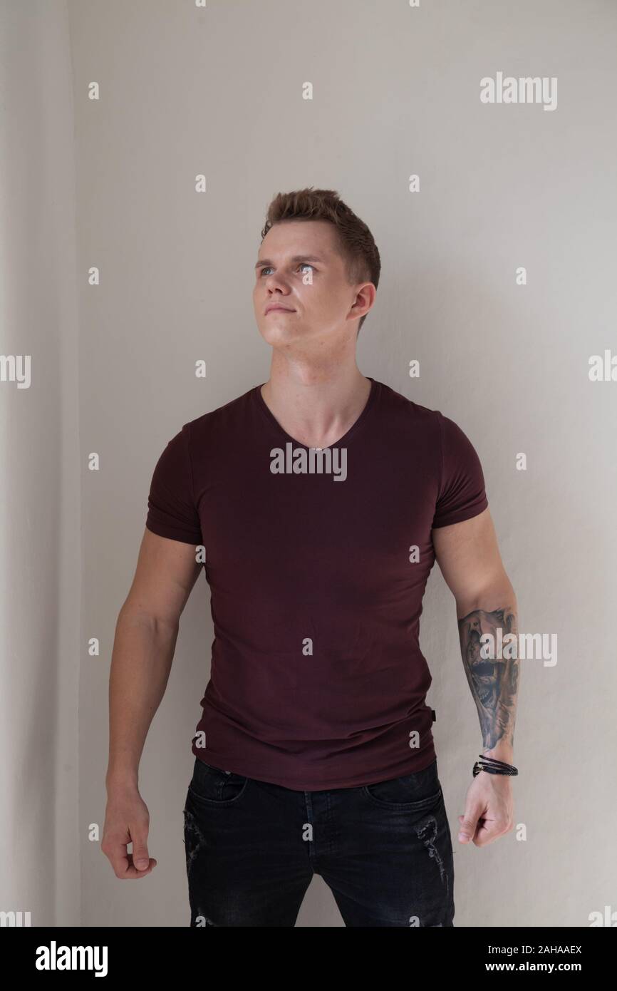 portrait of a beautiful fashionable strong man in stylish clothes Stock ...