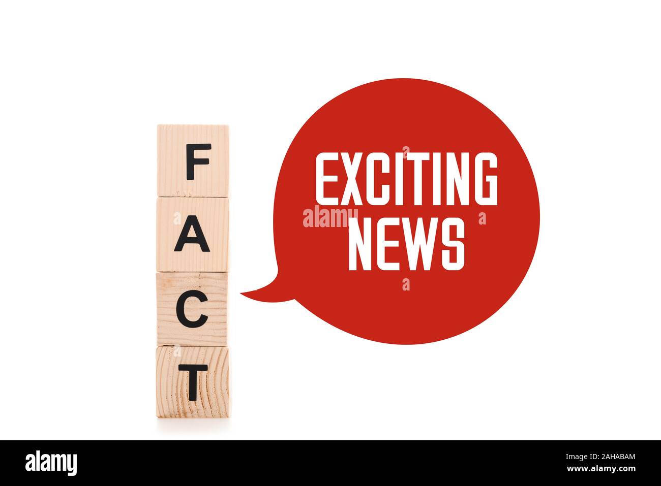 black fact word made of wooden blocks near red speech bubbles with ...