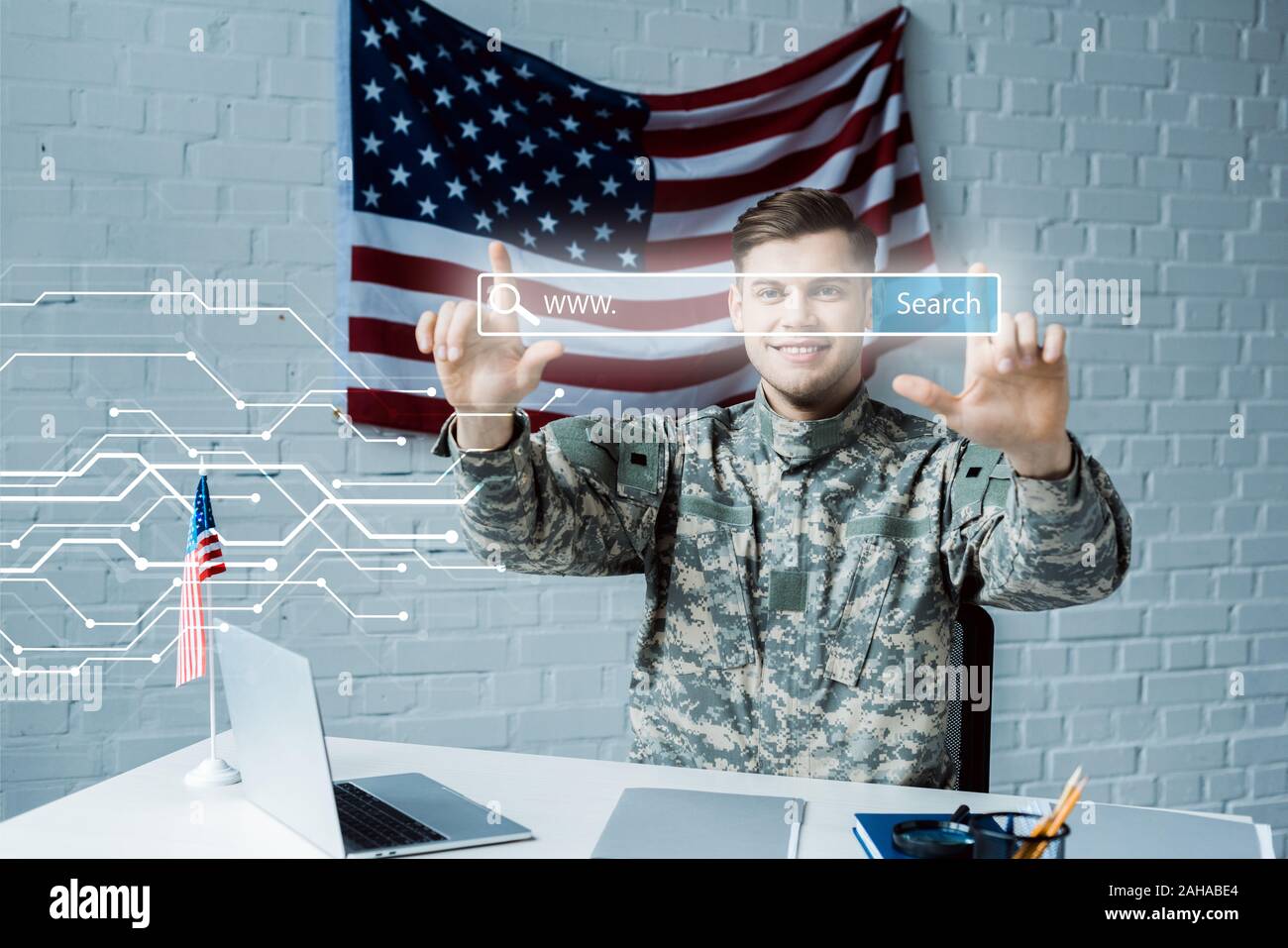 cheerful man in military uniform pointing with fingers at address bar ...