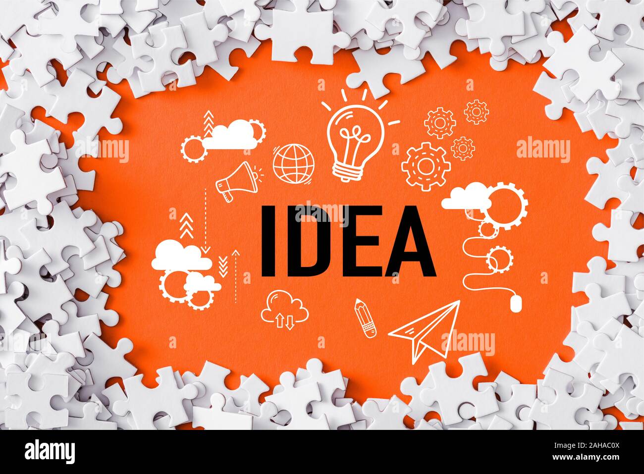 top view of frame of white jigsaw puzzle pieces around of idea ...