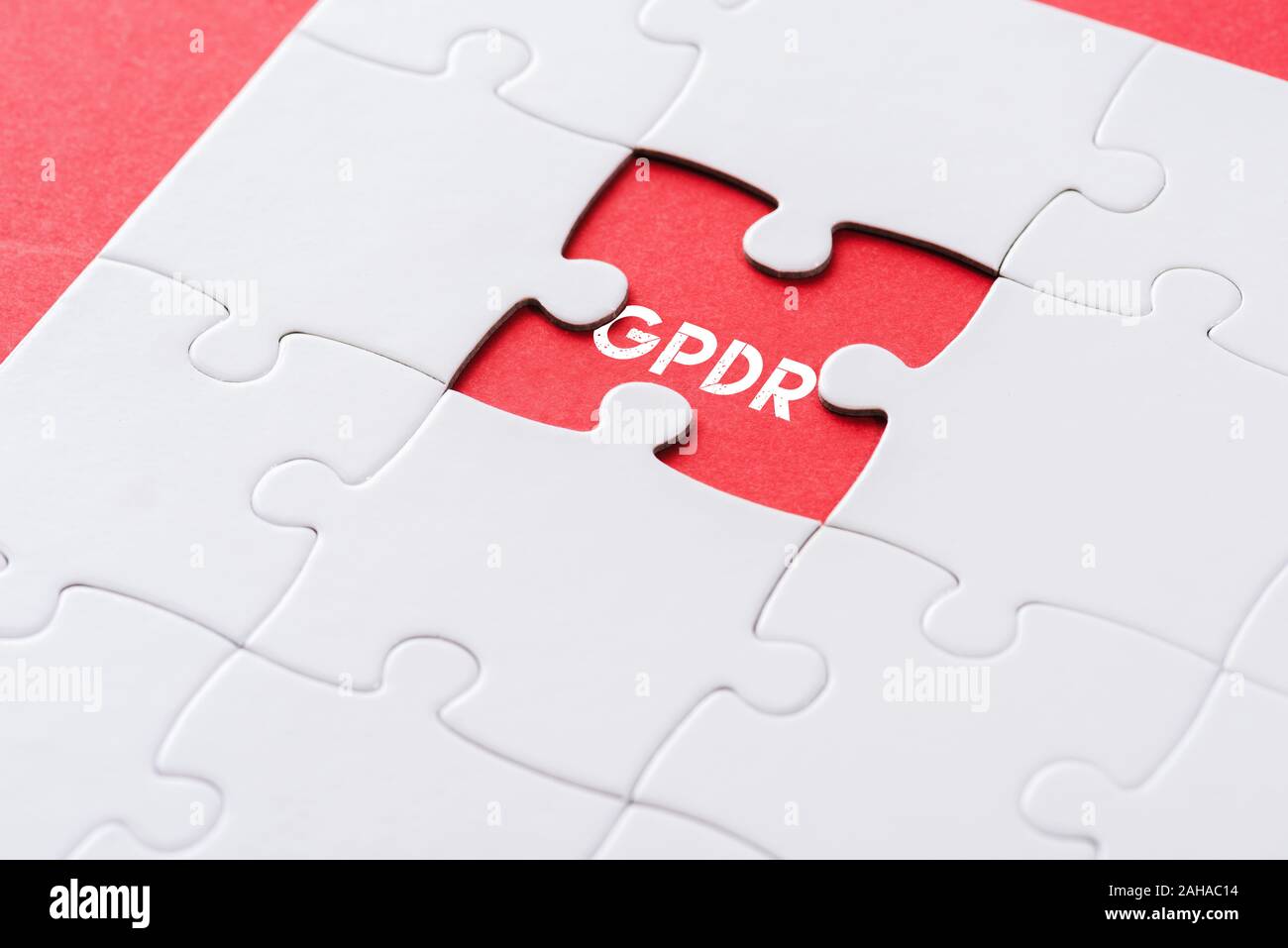 top view of white incomplete jigsaw puzzle pieces with gpdr lettering ...