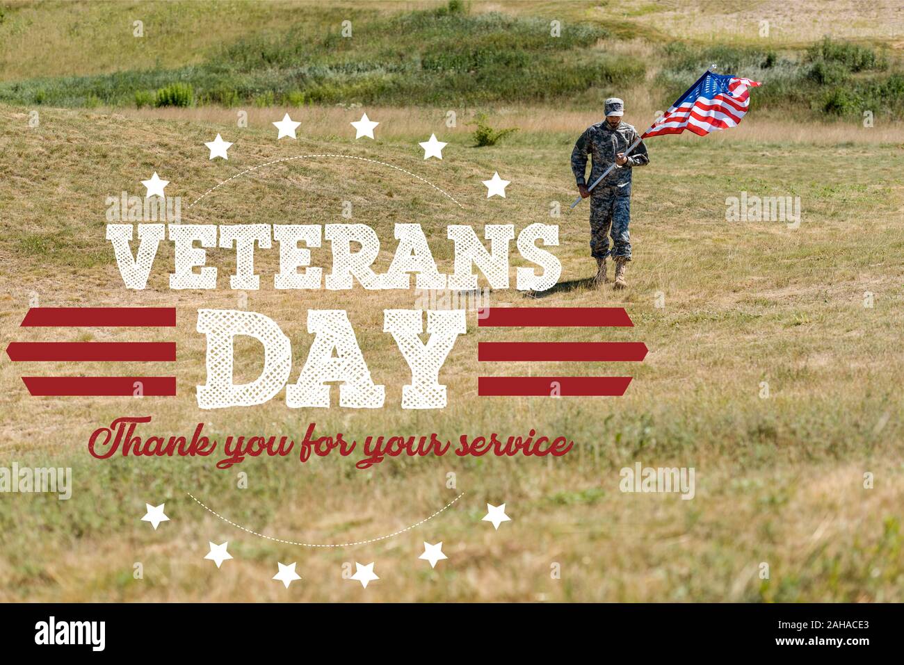 handsome soldier in uniform walking and holding american flag in ...