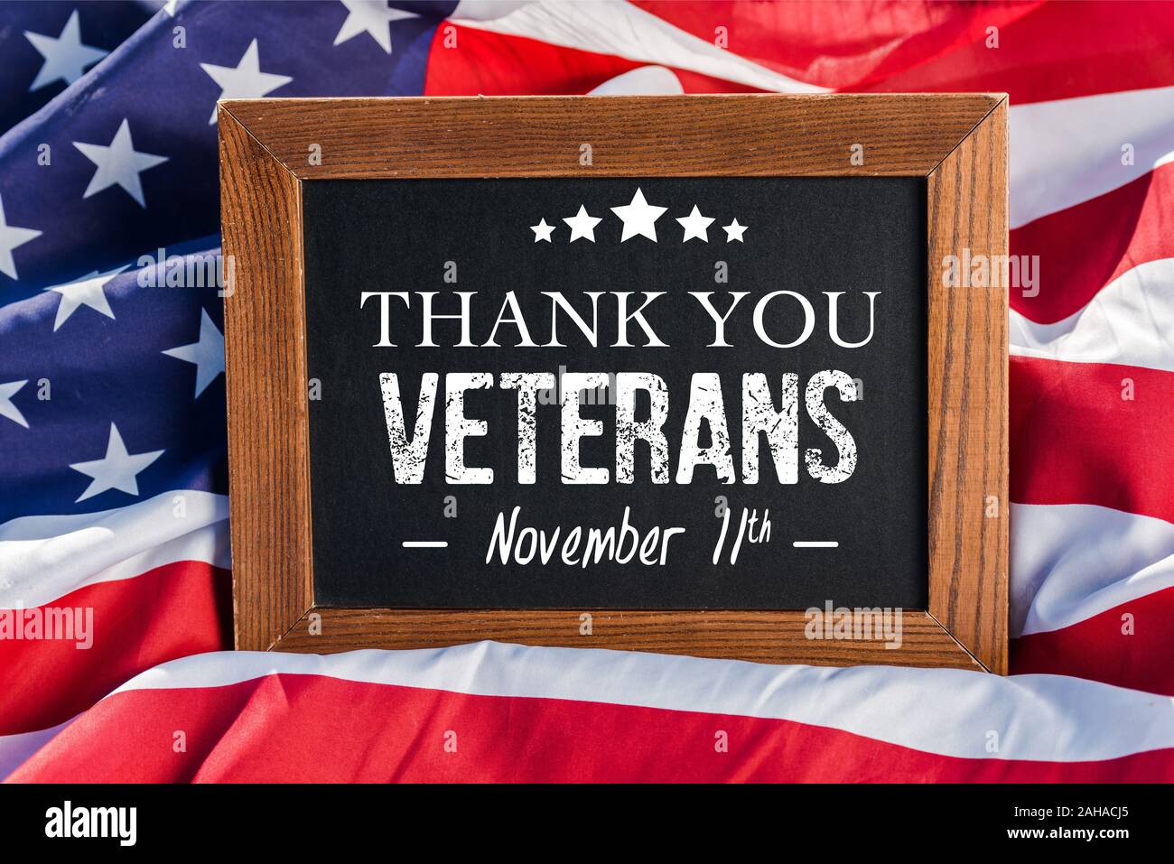 chalkboard with thank you veterans illustration on american flag with ...
