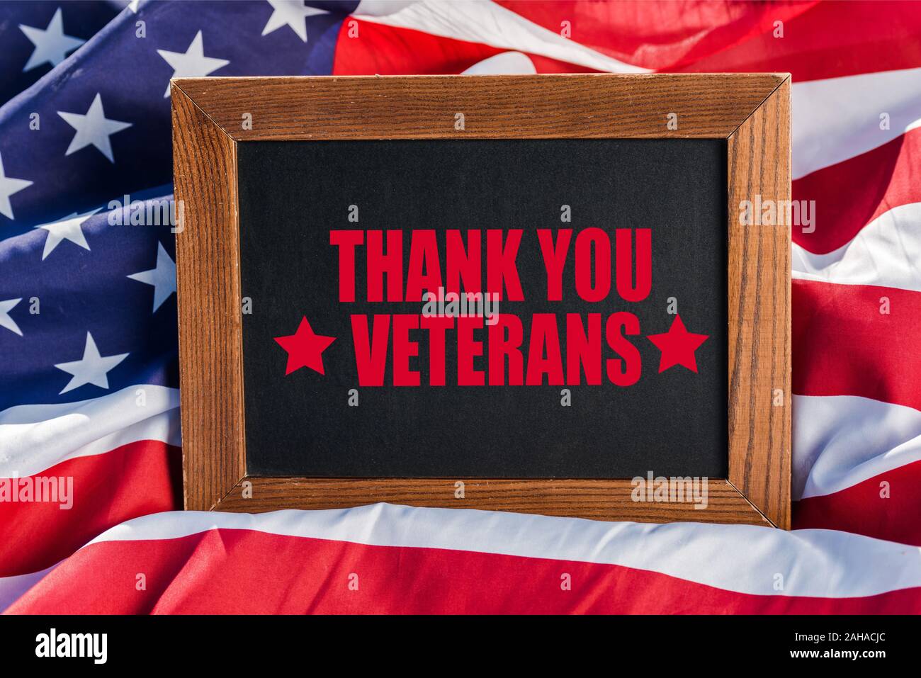 chalkboard with thank you veterans illustration on american flag with ...