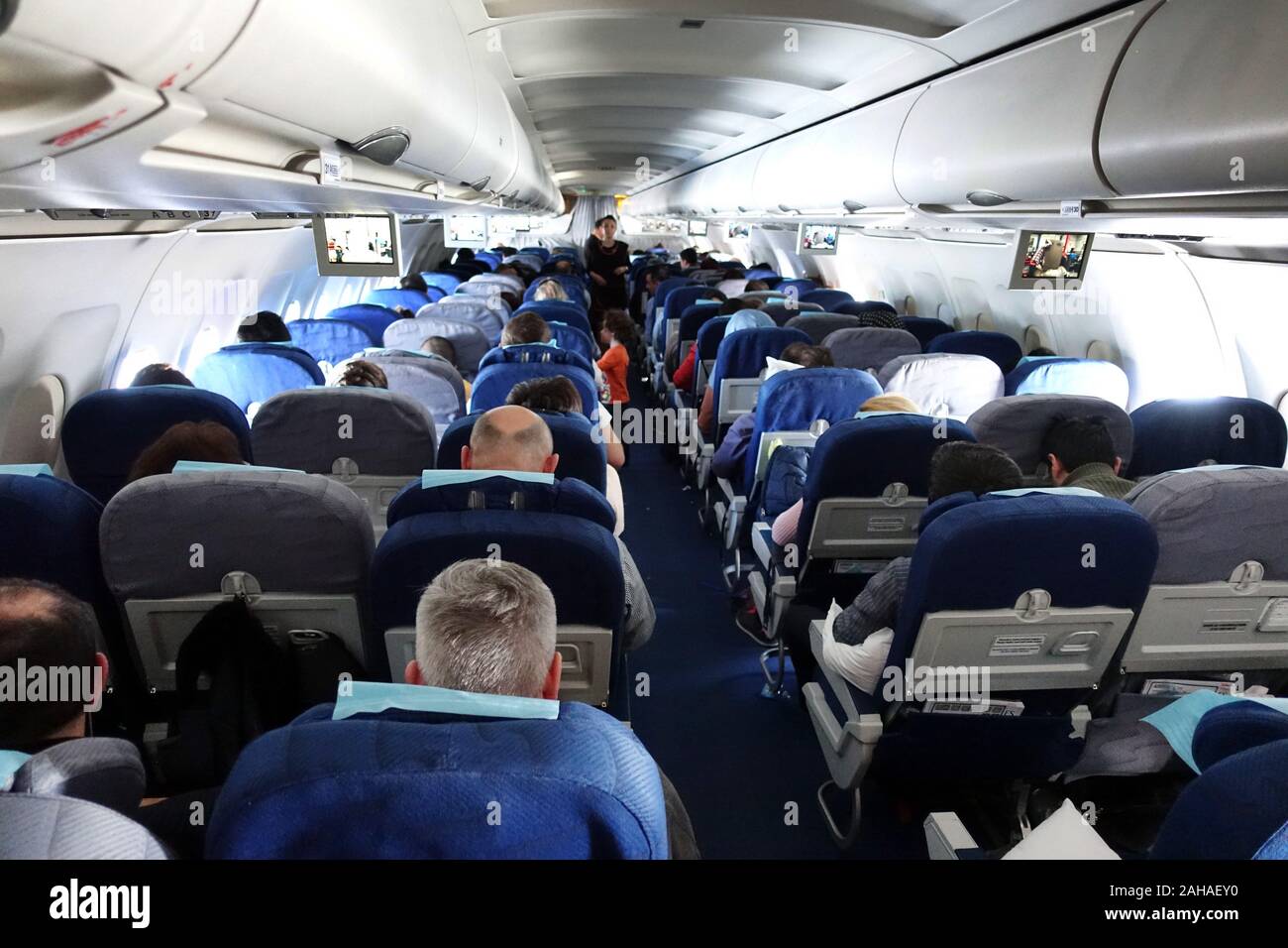 Cramped airline seat hi-res stock photography and images - Alamy