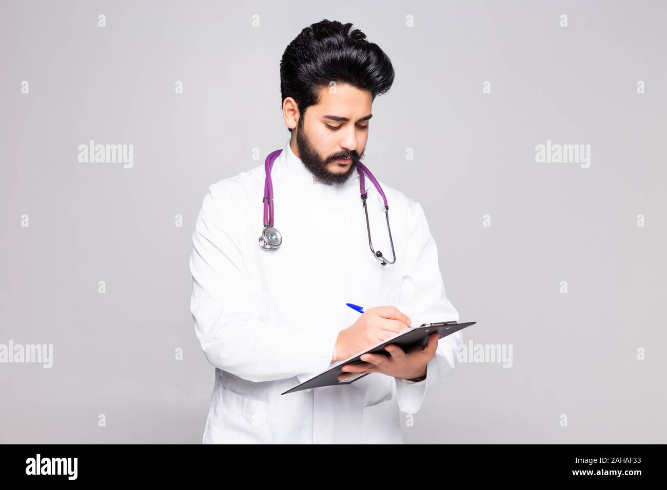 Doctor holding a medical chart Stock Photo - Alamy