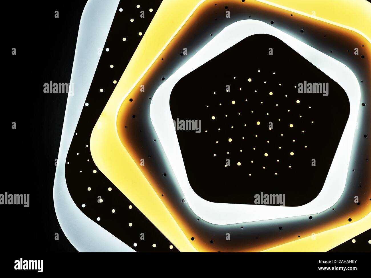 LED lamp with multi-colored glow on a black background. LED lighting in ...