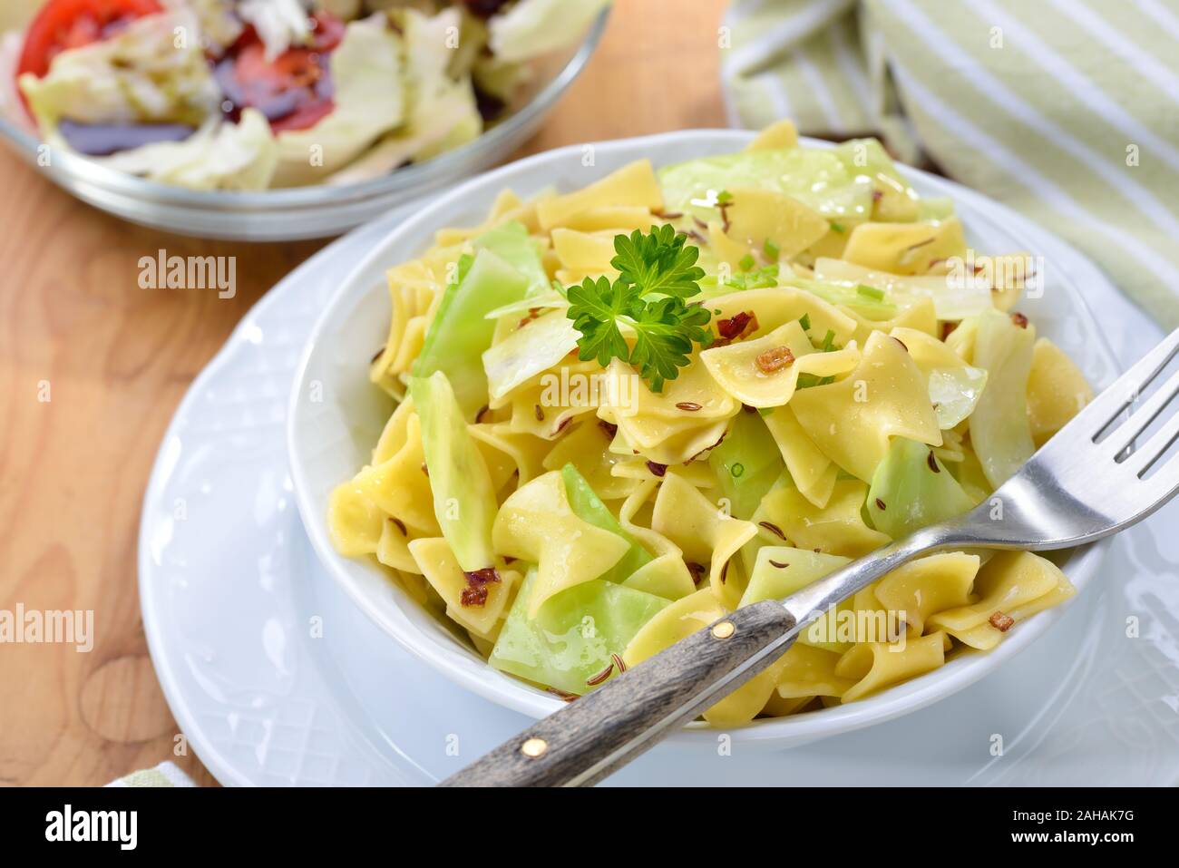 A vegetarian Austrian pasta meal with fried white cabbage called ...