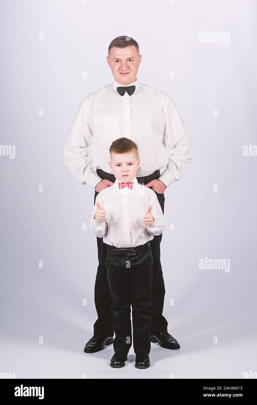 esthete. male fashion. little boy with dad businessman. family day ...