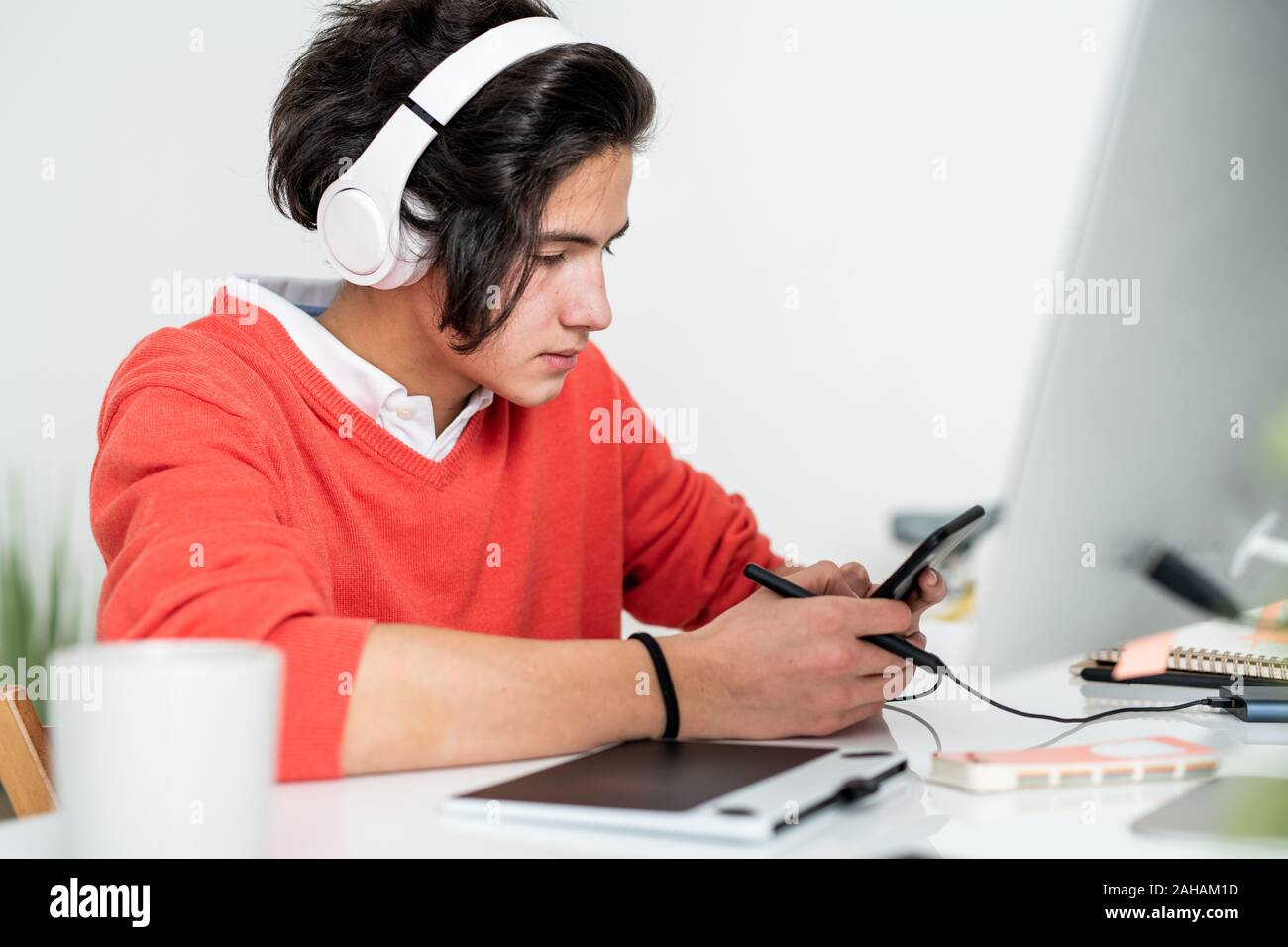 Woman scrolling smartphone desk hi-res stock photography and images - Alamy