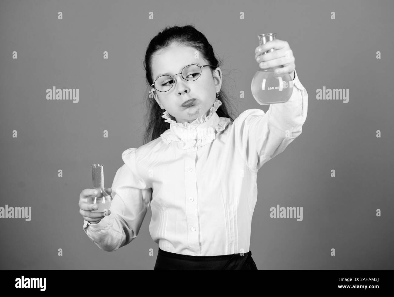 small smart girl with testing flask. back to school. education and ...